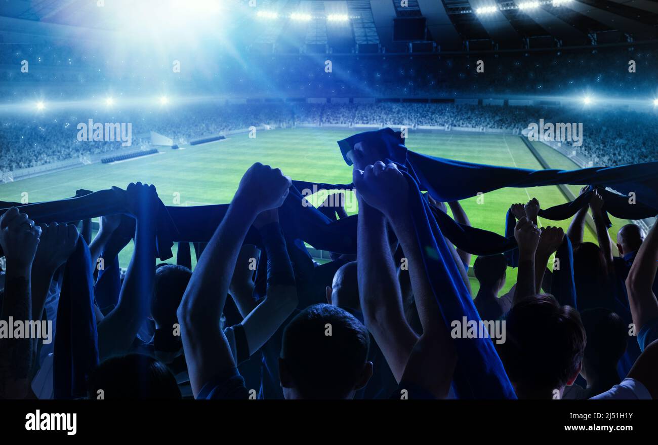 Back view of football, soccer fans cheering their team with scarfs at ...