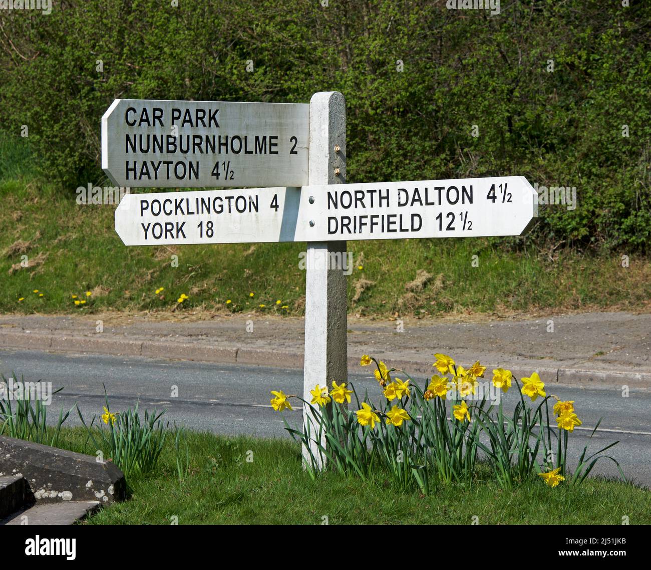 Traditional wooden road sign in the village of Warter in East Yorkshire ...