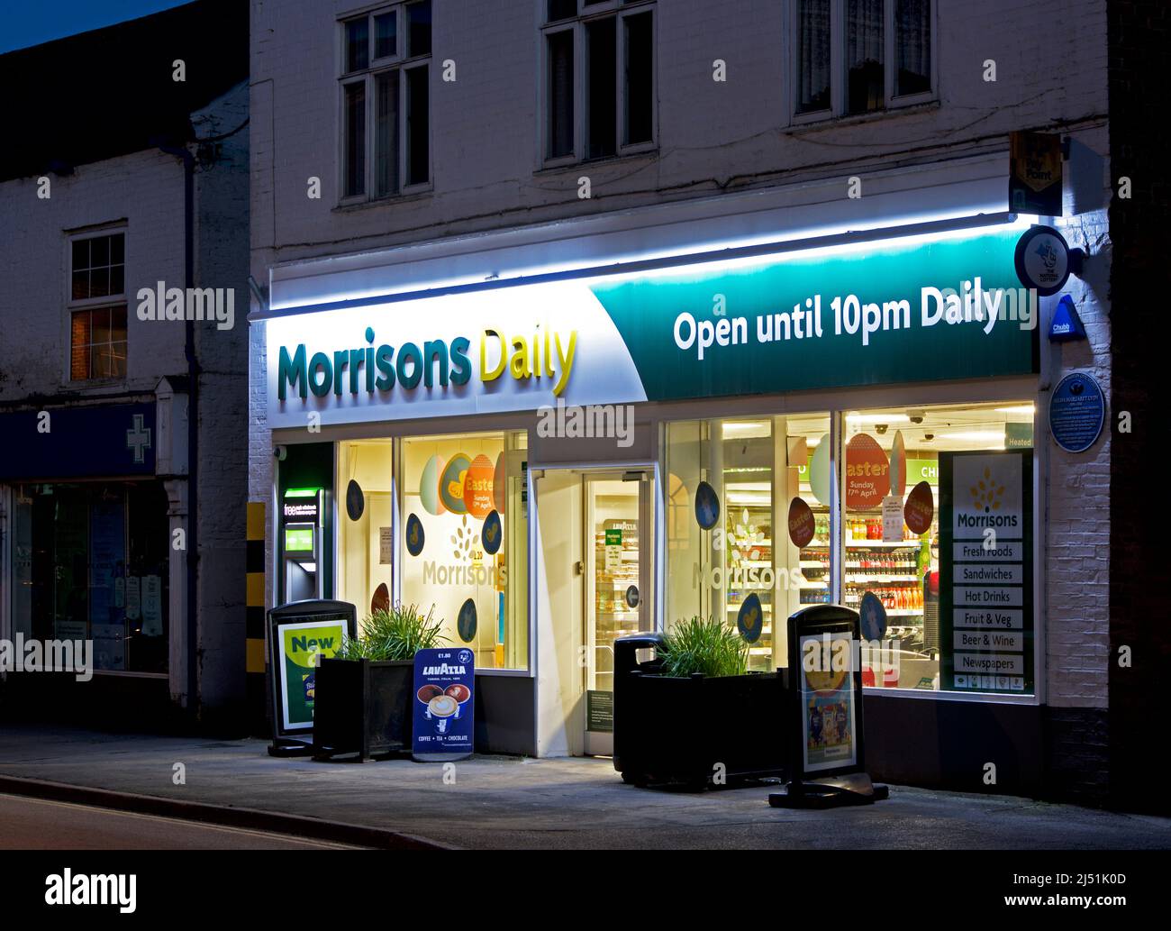Morrisons Daily shop on the high street, at dusk, Market Weighton, East ...