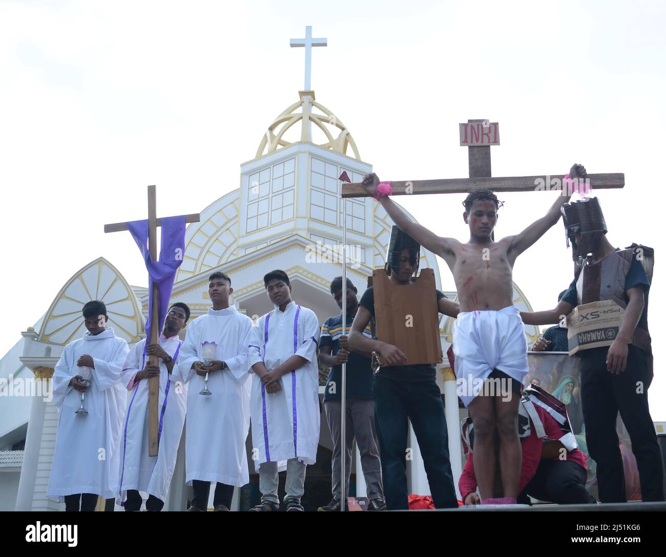 Christian devotees take part in the re-enactment of the crucifixion of ...