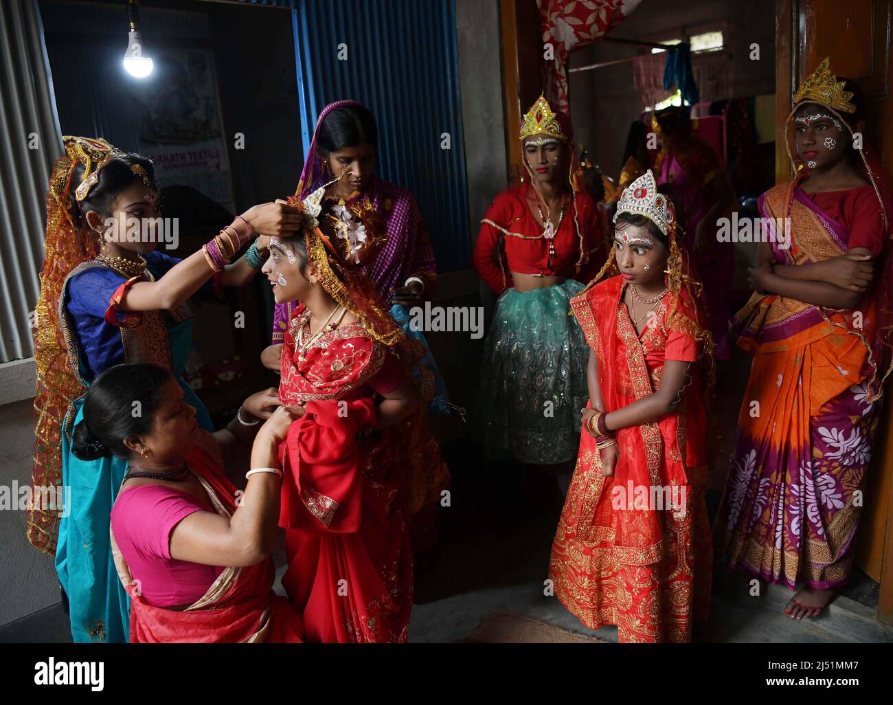 Folk artists are getting their makeup done to perform at the rituals of ...
