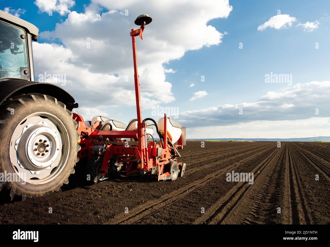 Agricultural machinery - Tractor and seeder for sowing corn Stock Photo ...