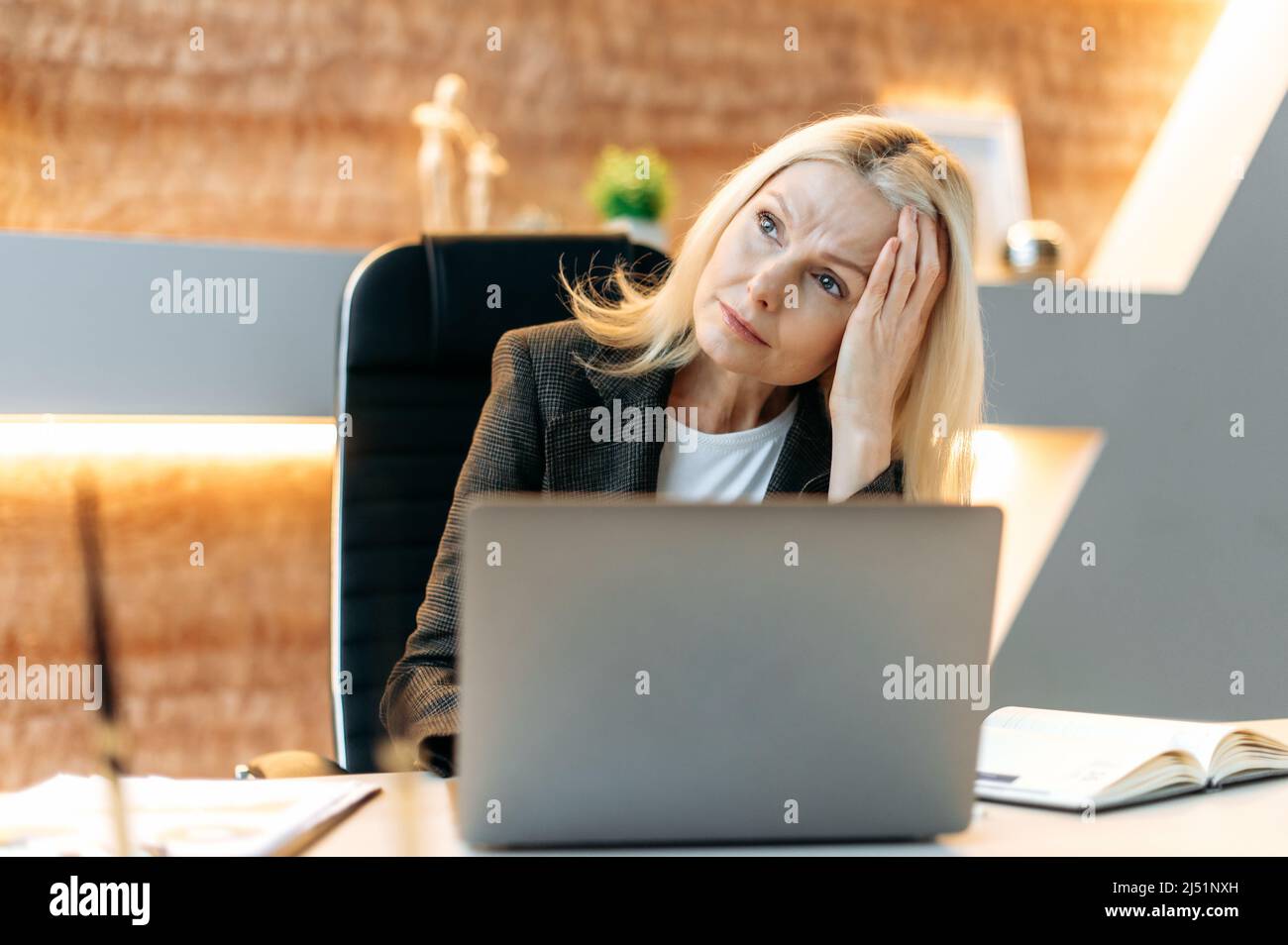 Overworked exhausted sad caucasian mature blonde business woman, female ...