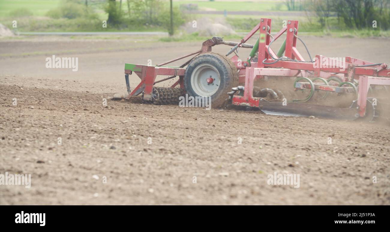 Tractor plowing field. Agriculture background Stock Photo - Alamy
