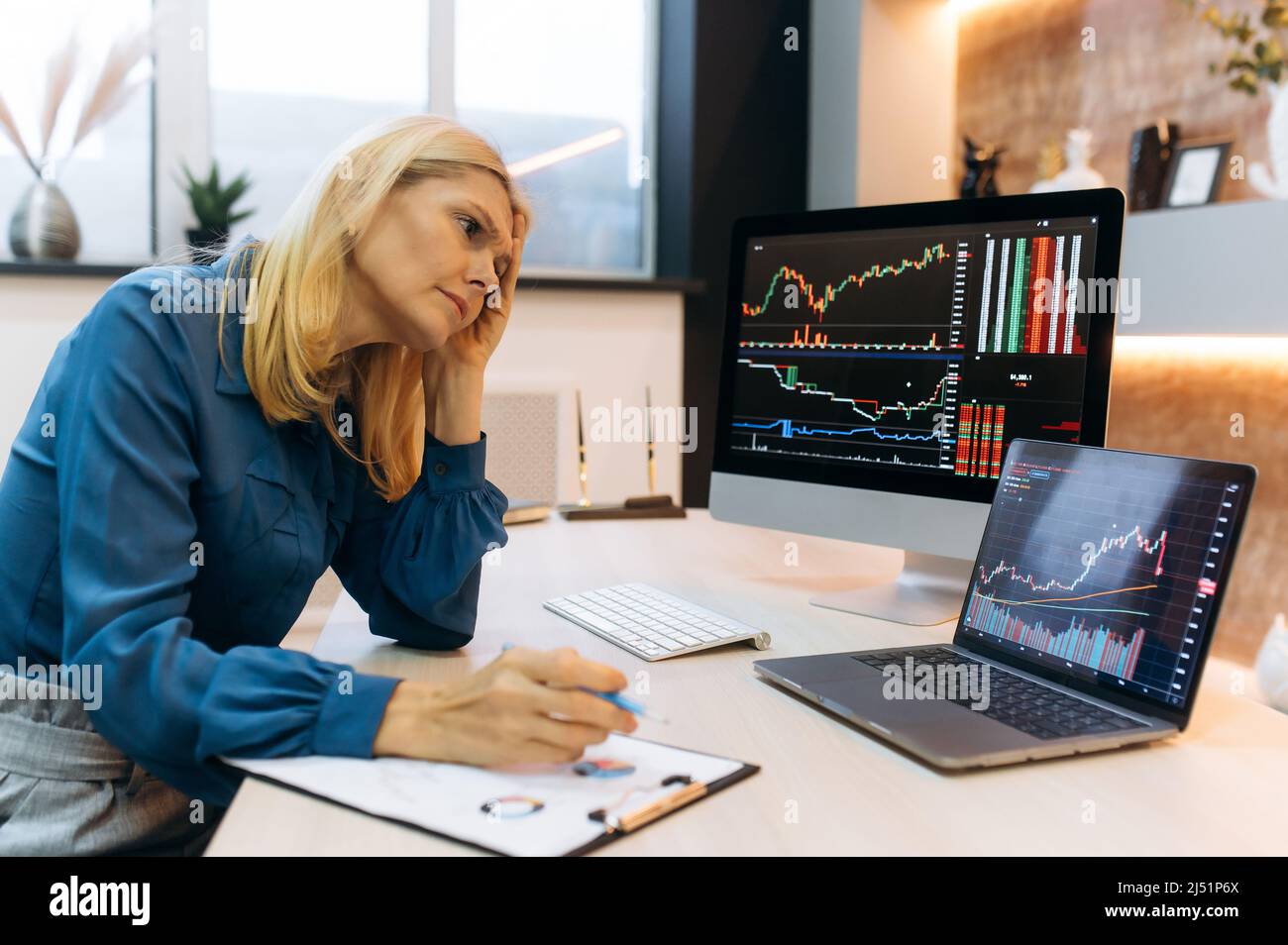Tired overworked sad mature caucasian smart blonde woman, a stock ...