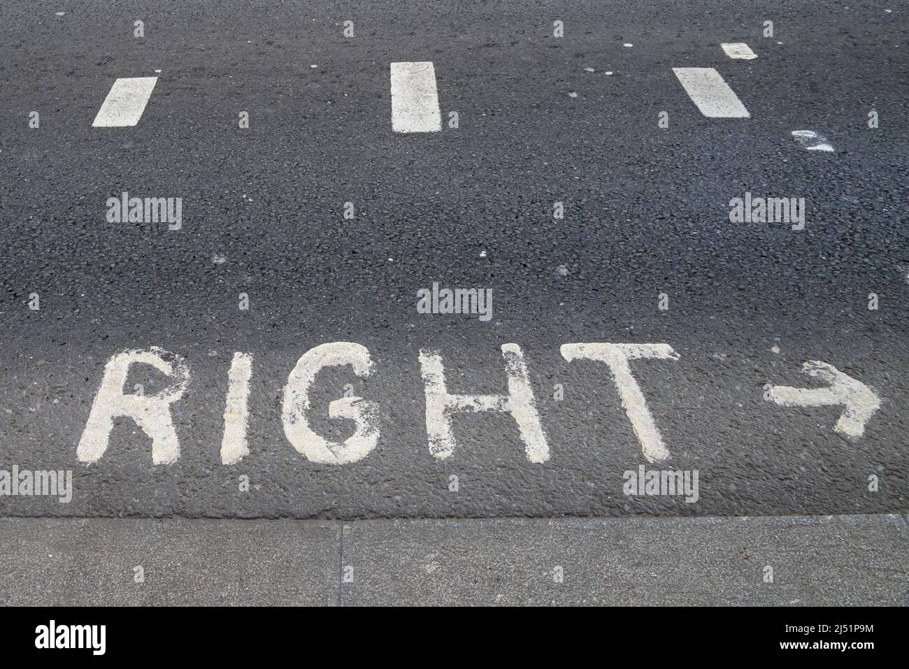 Look right road paint with arrow at road crossing, UK Stock Photo - Alamy
