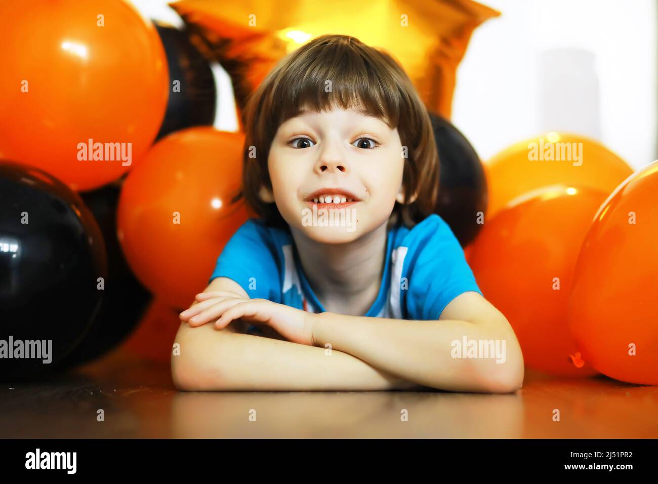 Baby's birthday in the decorated area, portrait of a happy kid, indoor ...