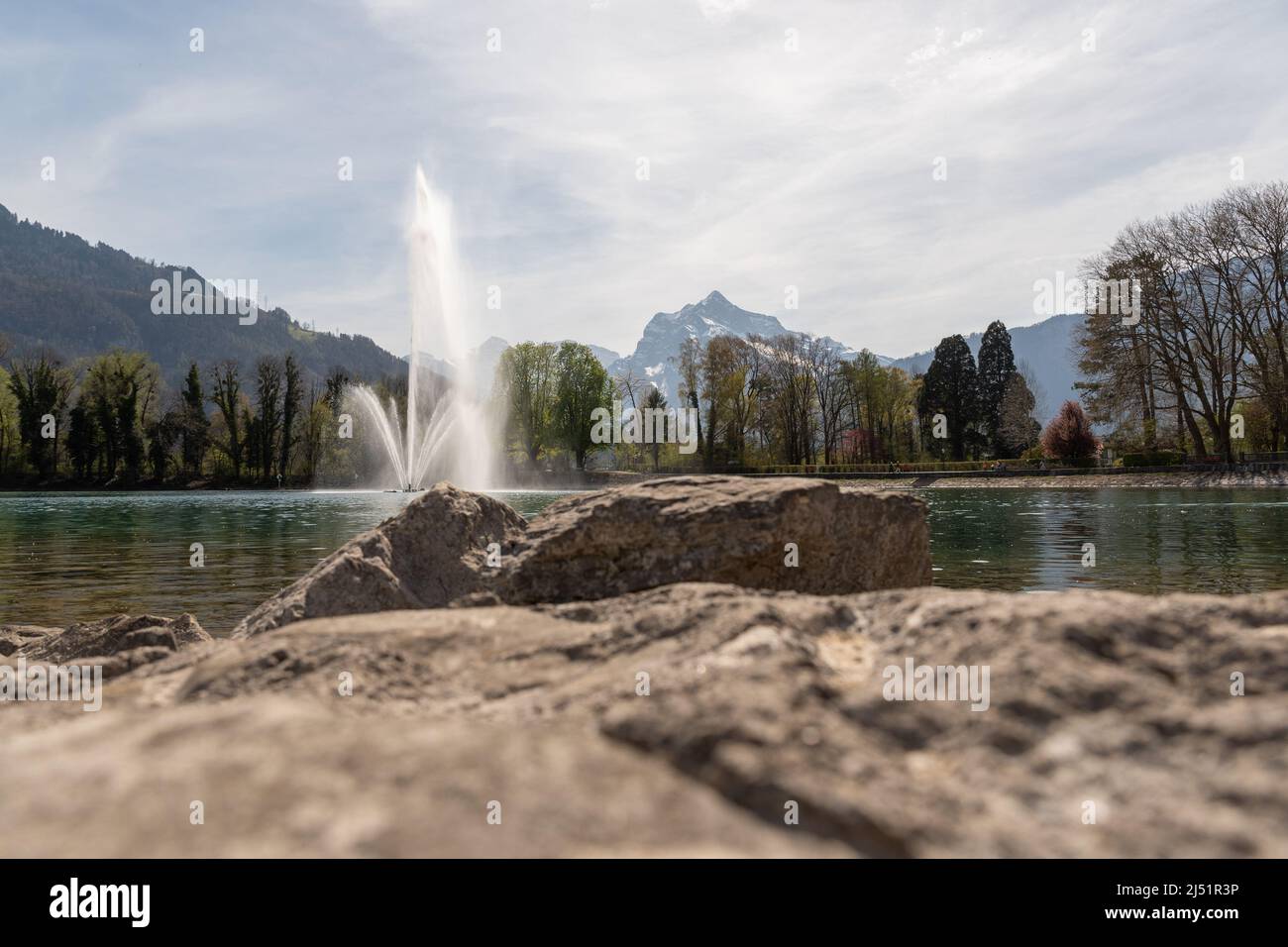 Weesen, Switzerland, April 13, 2022 Water fountain at the lake of ...
