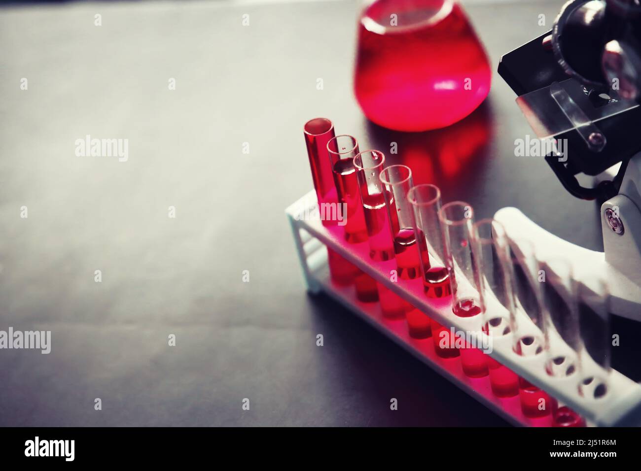 Test tube with blue liquid on laboratory table. Examination of liquid ...