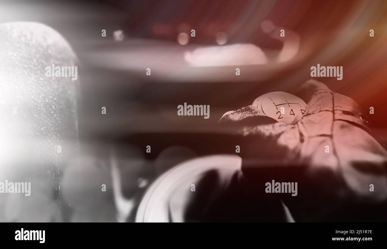 Hand on car gear knob. The driver switches the speed in the car. Hand ...