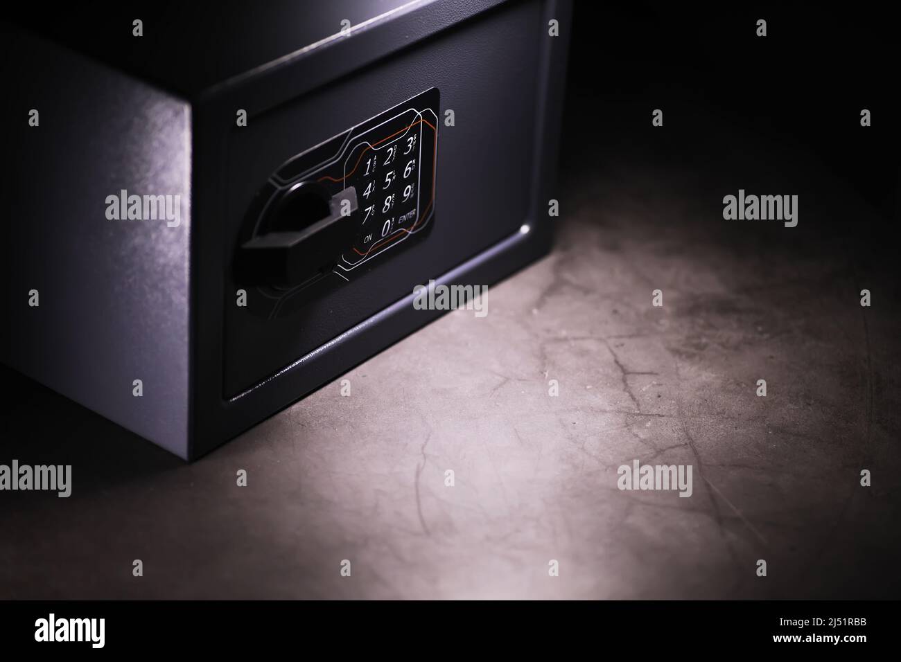 Steel safe with money. Hand putting password in the safety money box in ...