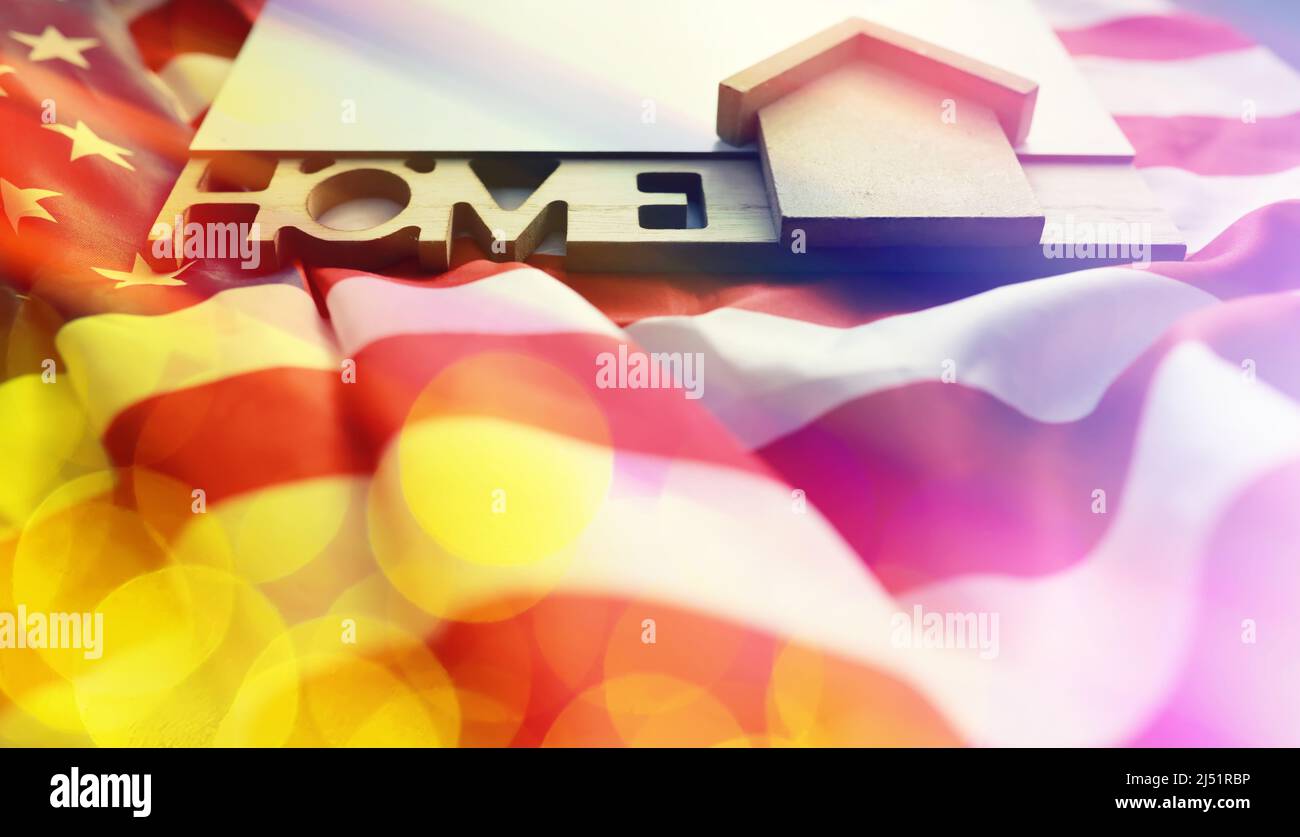 House symbol on American flag. Mortgage credit lending. Housing safety ...