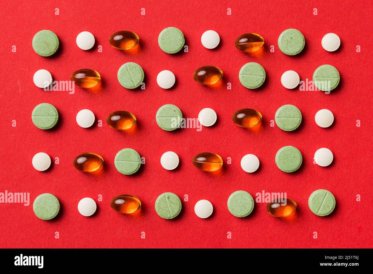 Many different pills and space for text on colorful background, top ...