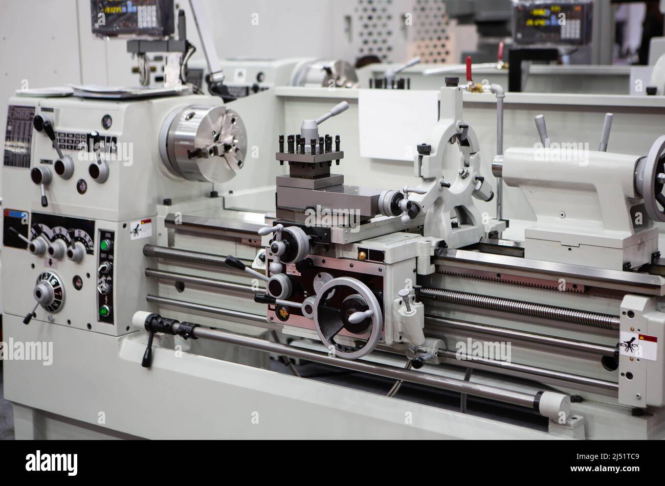 Metalwork workshop. Lathe turning machine in industrial factory Stock ...