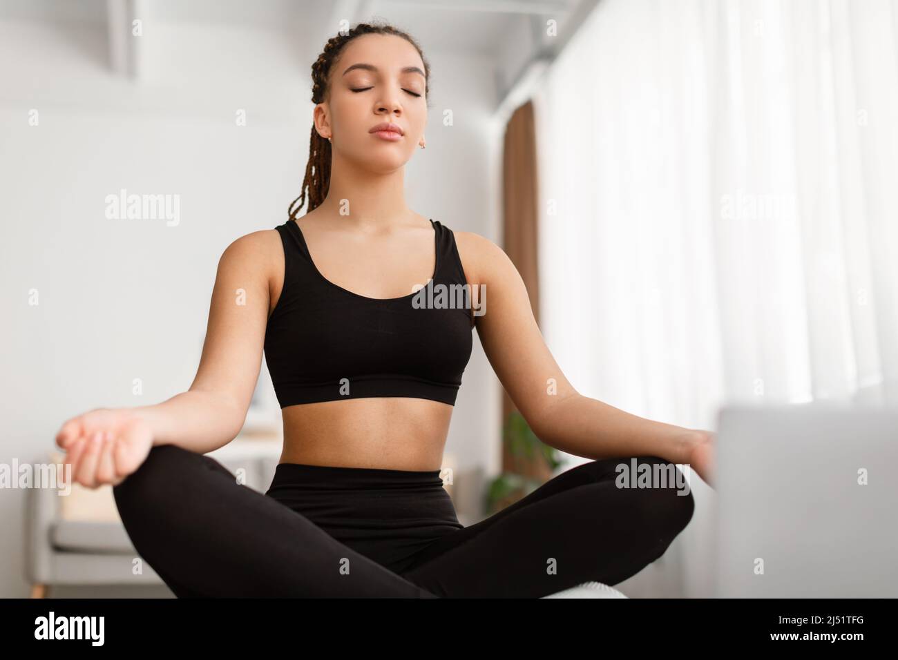 Calm African American Woman Meditating Sitting Doing Yoga At Home Stock ...