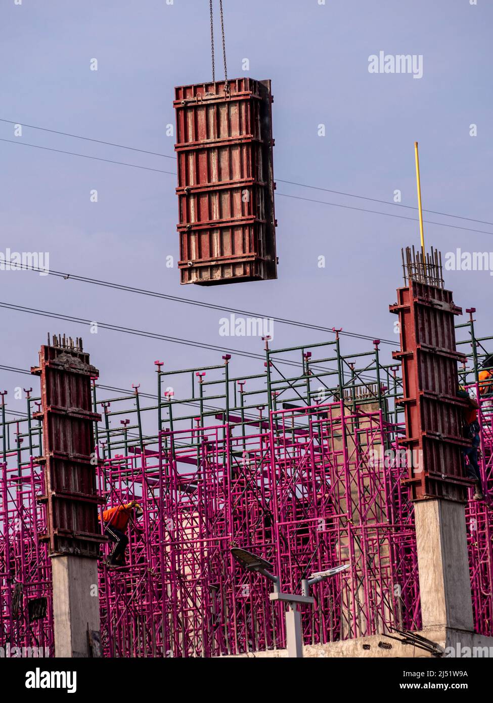 The pink scaffolding on the building under construction Stock Photo - Alamy