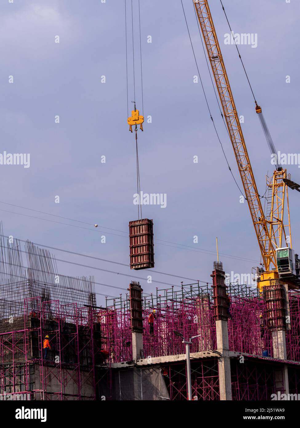 The pink scaffolding on the building under construction Stock Photo - Alamy