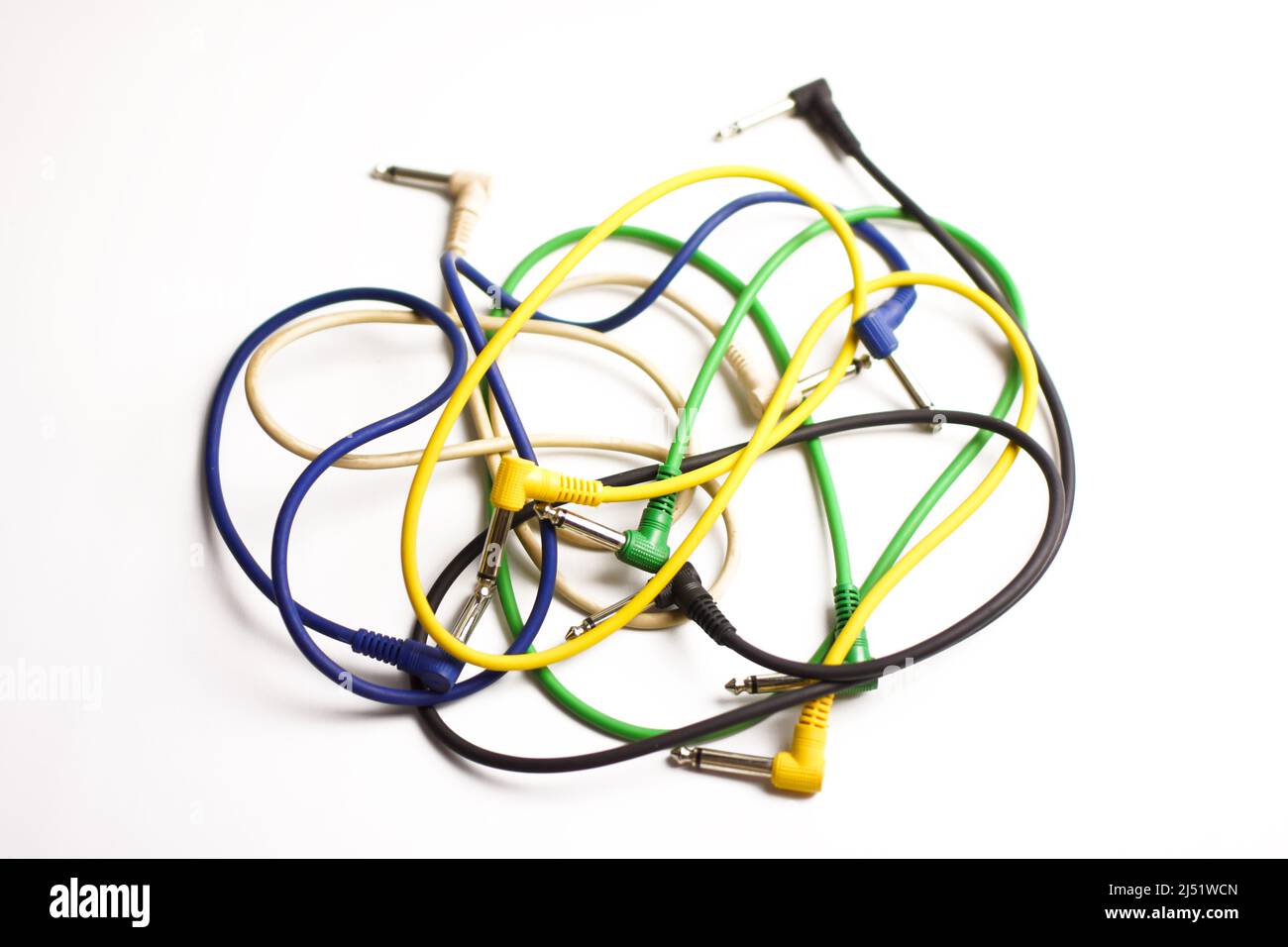 tangled colorful guitar cable Stock Photo - Alamy