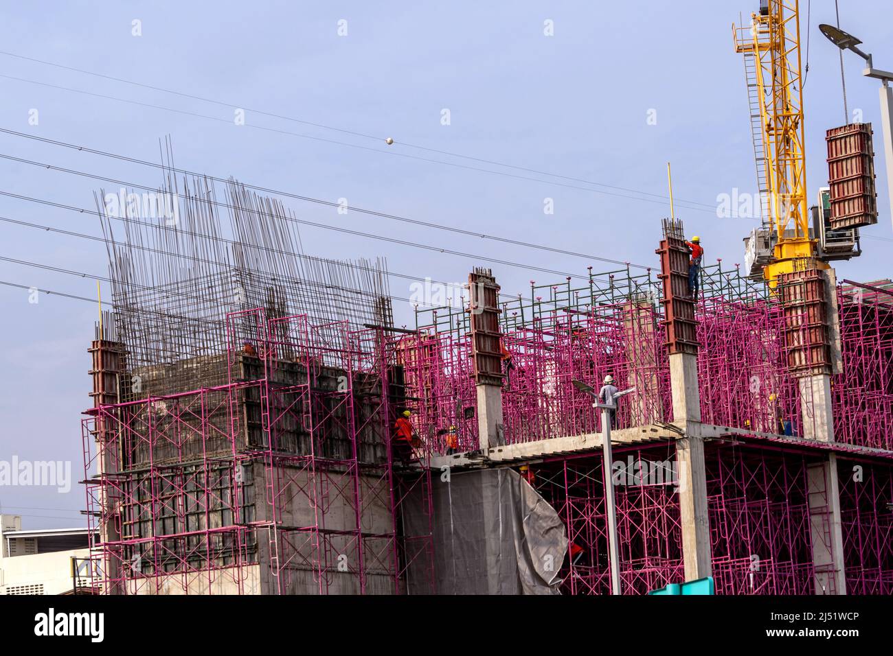 The pink scaffolding on the building under construction Stock Photo - Alamy