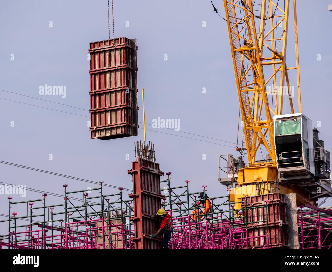 The pink scaffolding on the building under construction Stock Photo - Alamy