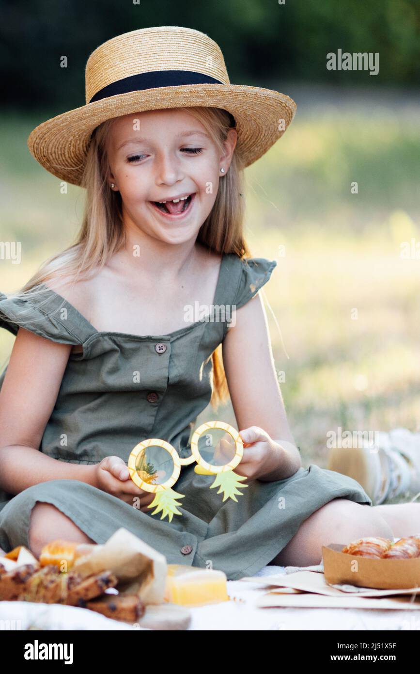 Candid lifestyle portrait of caucasian little girl eating healthy food ...