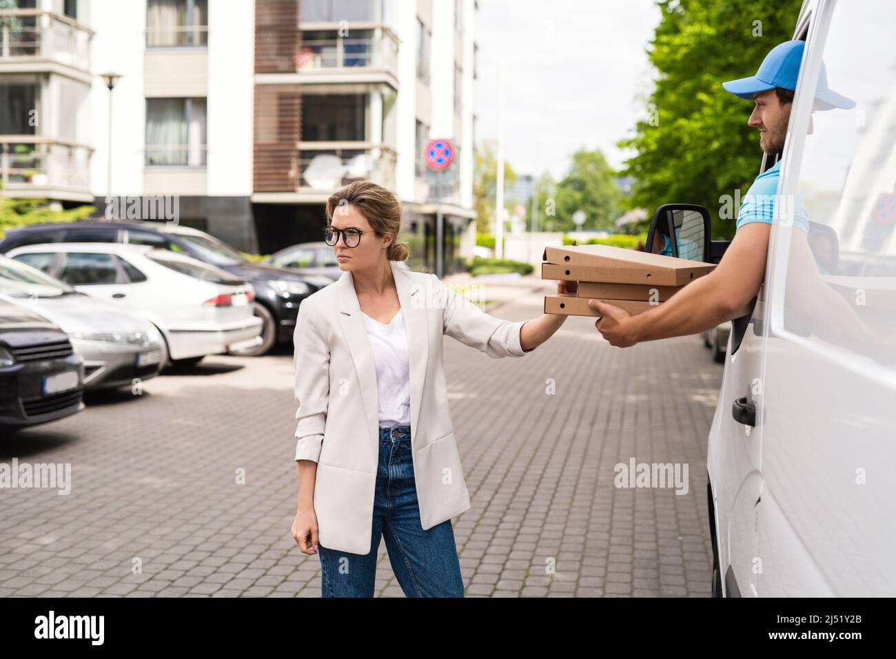 Client dissatisfaction. Angry woman because courier brings wrong pizza ...