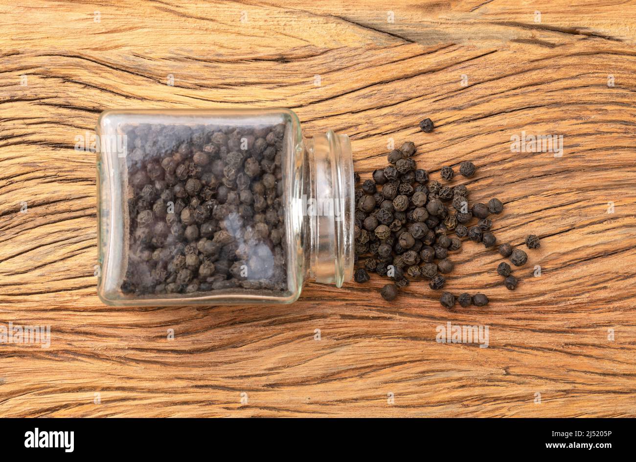 Top view, closeup of dried black pepper grains on a glass pot Stock ...