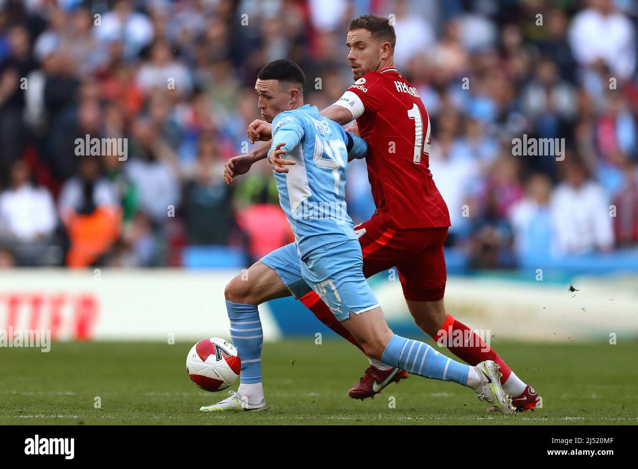 Phil Foden of Manchester City and Jordan Henderson of Liverpool ...