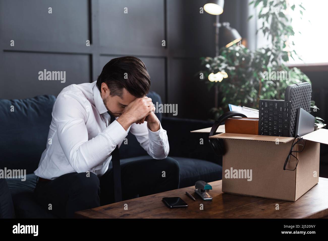 Young man getting fired from his job Stock Photo - Alamy