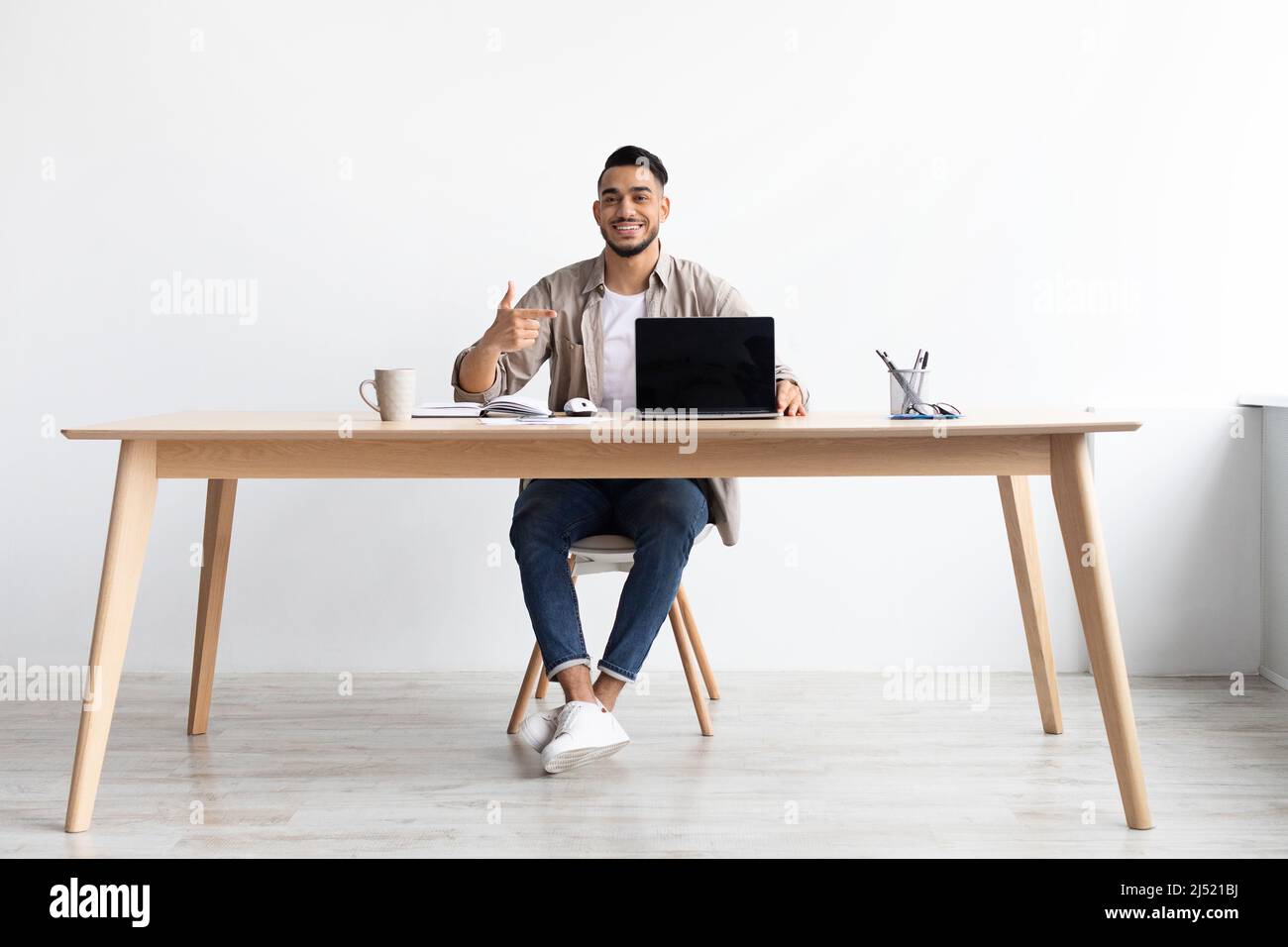 Happy Arab Guy Showing Laptop With Black Empty Screen, Mockup Stock ...