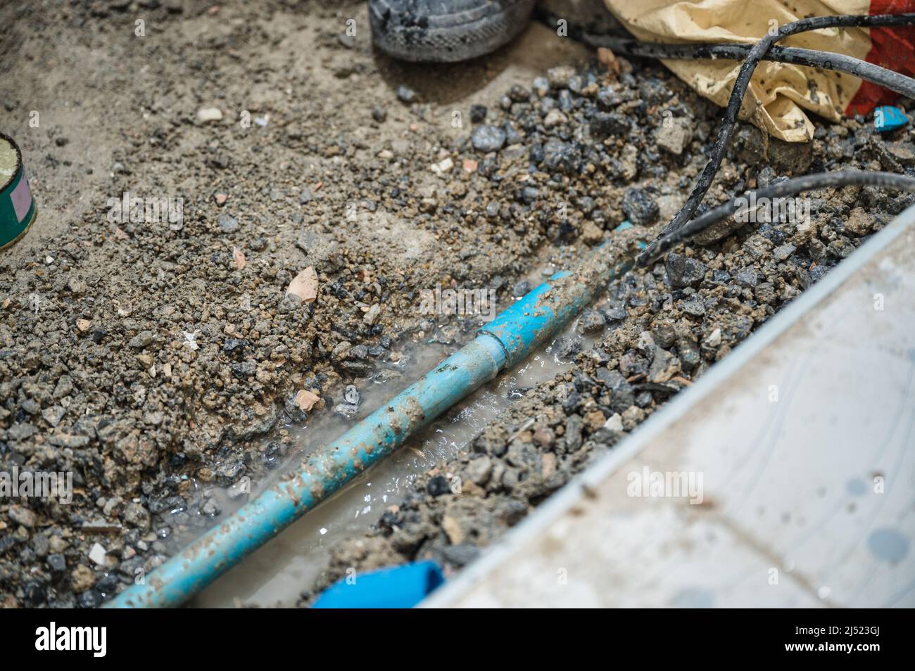 Demolition fixing leak sewerage pipe on the floor in bathroom. Home ...