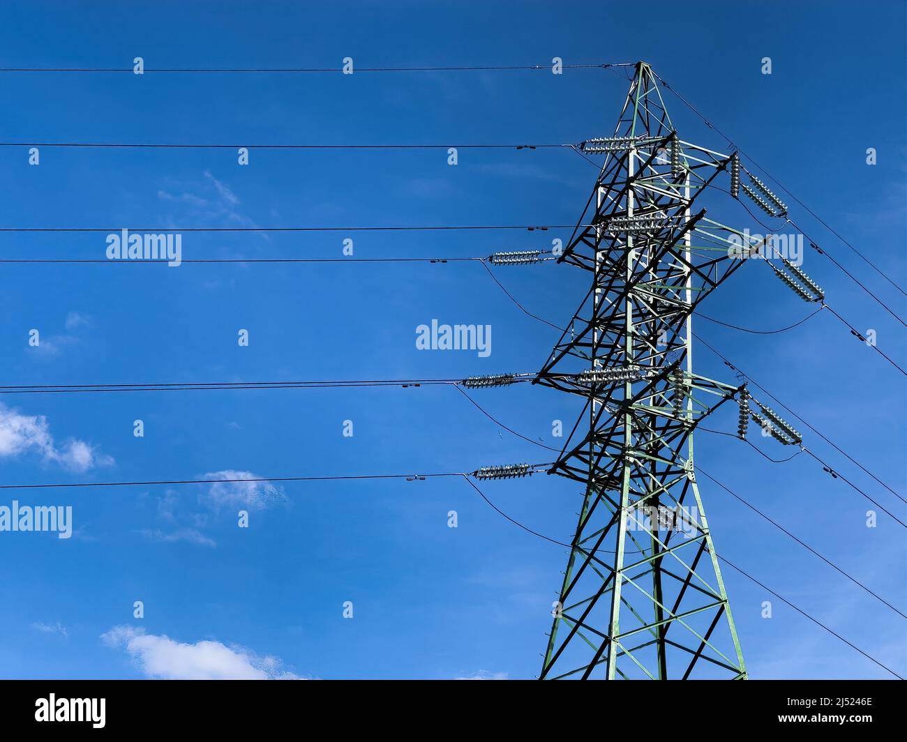 High voltage electrical network on blue the sky backdrop Stock Photo ...
