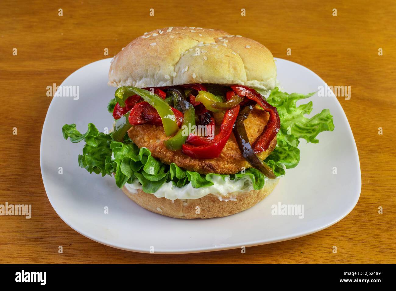 chicken patty sandwich t with sauteed peppers as a topping Stock Photo ...