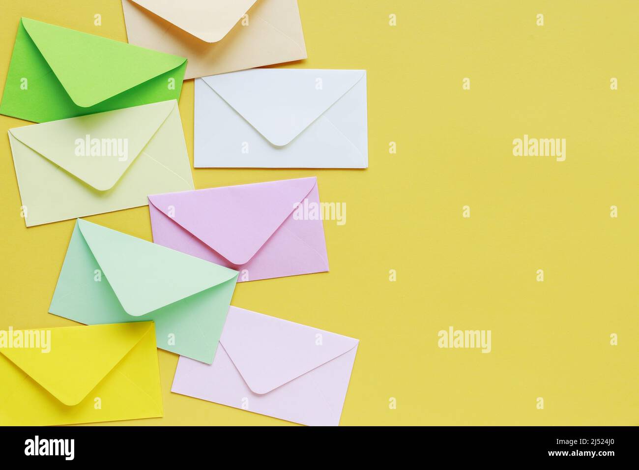 Colorful envelopes on yellow background, copy space Stock Photo - Alamy