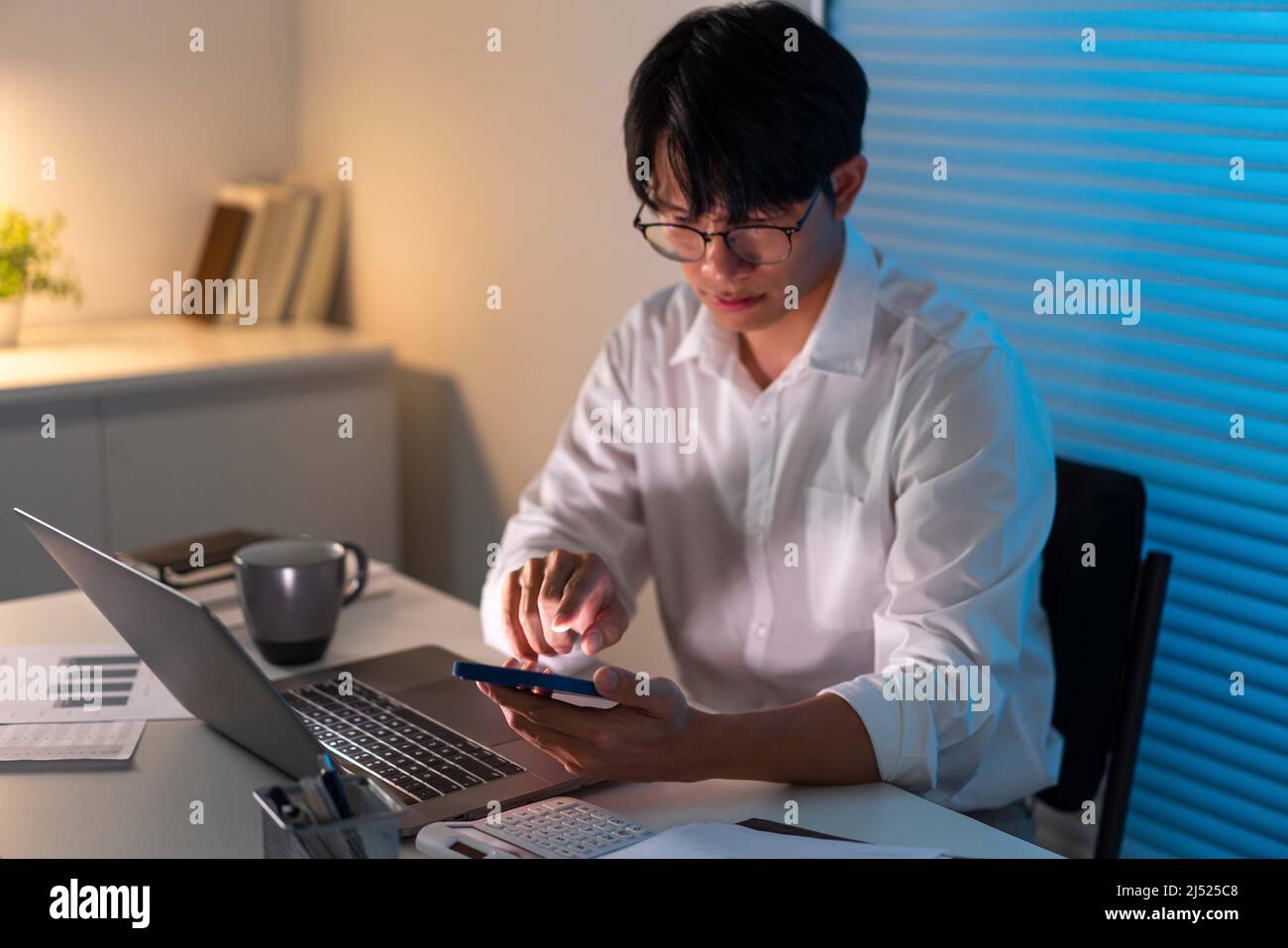 Overwork Concept The male office employee who wears white blazer ...