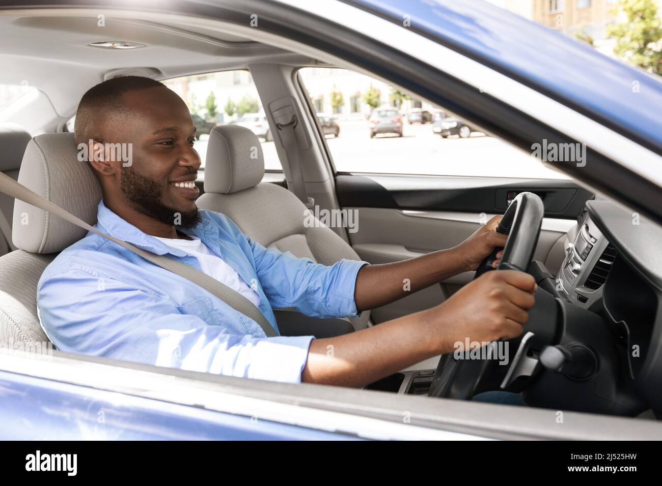 Black guy driving car hi-res stock photography and images - Alamy