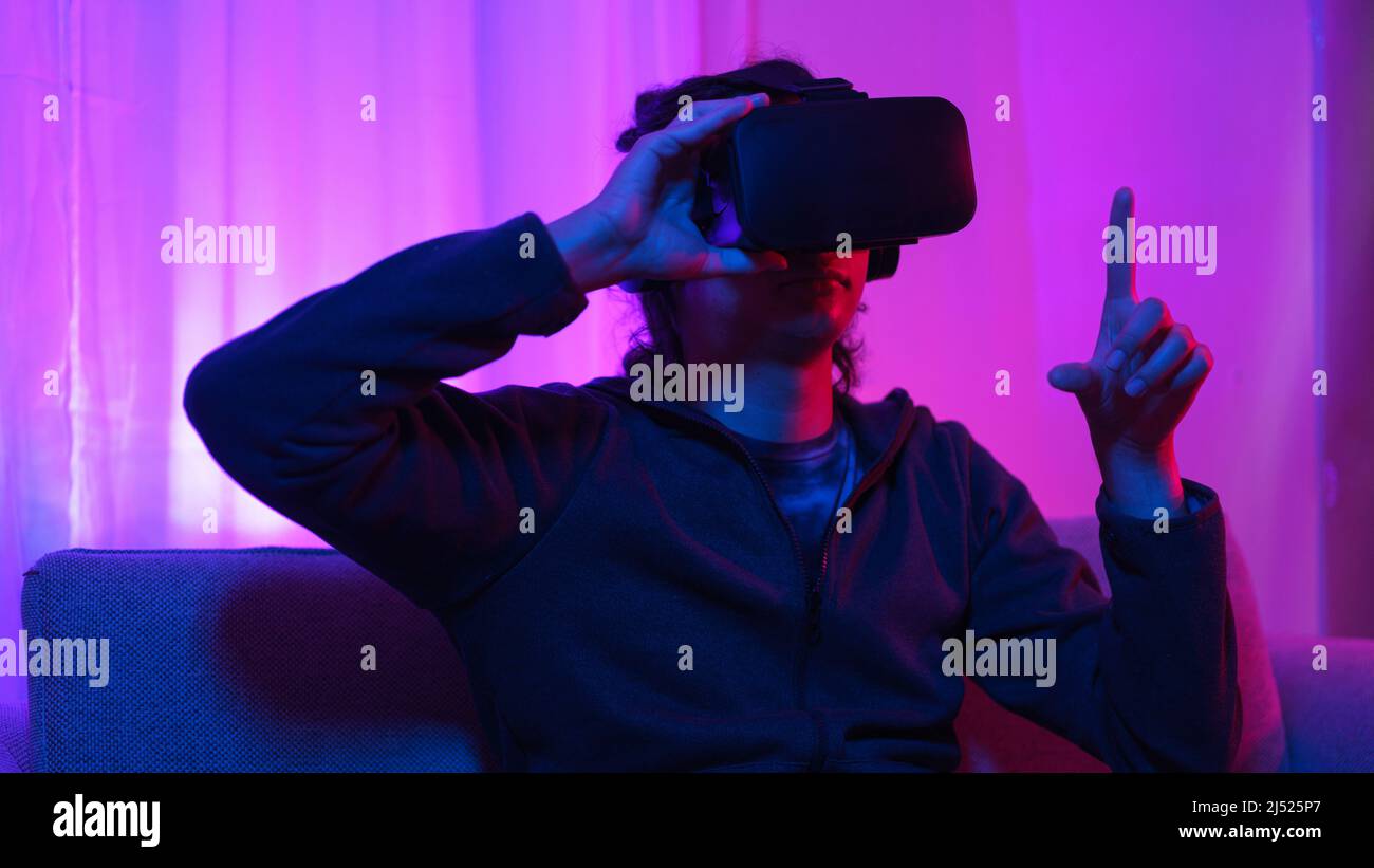 Metaverse technology concept, Man holding VR goggles and pointing to ...