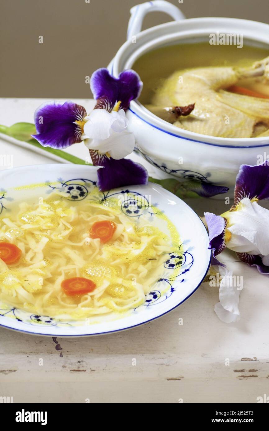 Traditional broth (chicken soup) with noodles. Party dish Stock Photo ...