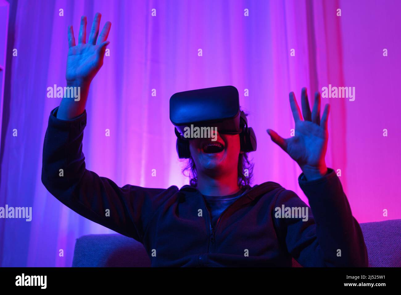 Metaverse technology concept, Man wear VR goggles and have fun to touch ...