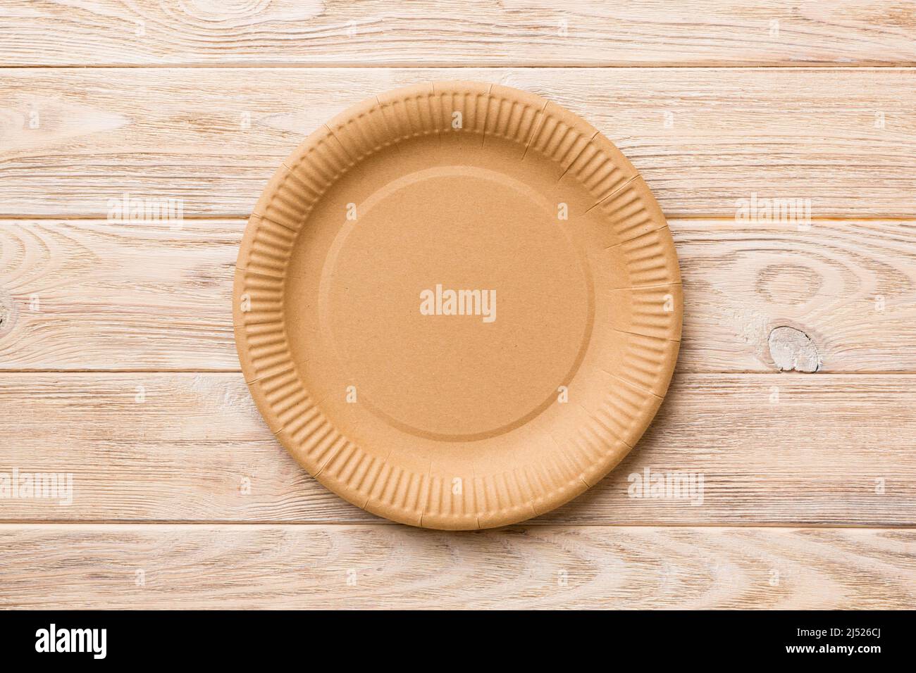 Top view of eco paper plate on wooden background. Empty space for your ...