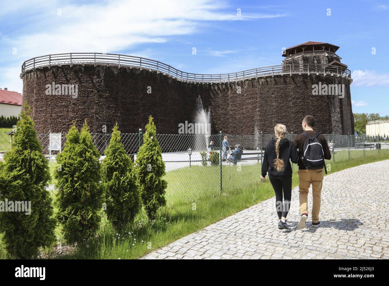 Young tourists are visiting a graduation tower in Wieliczka, Poland ...