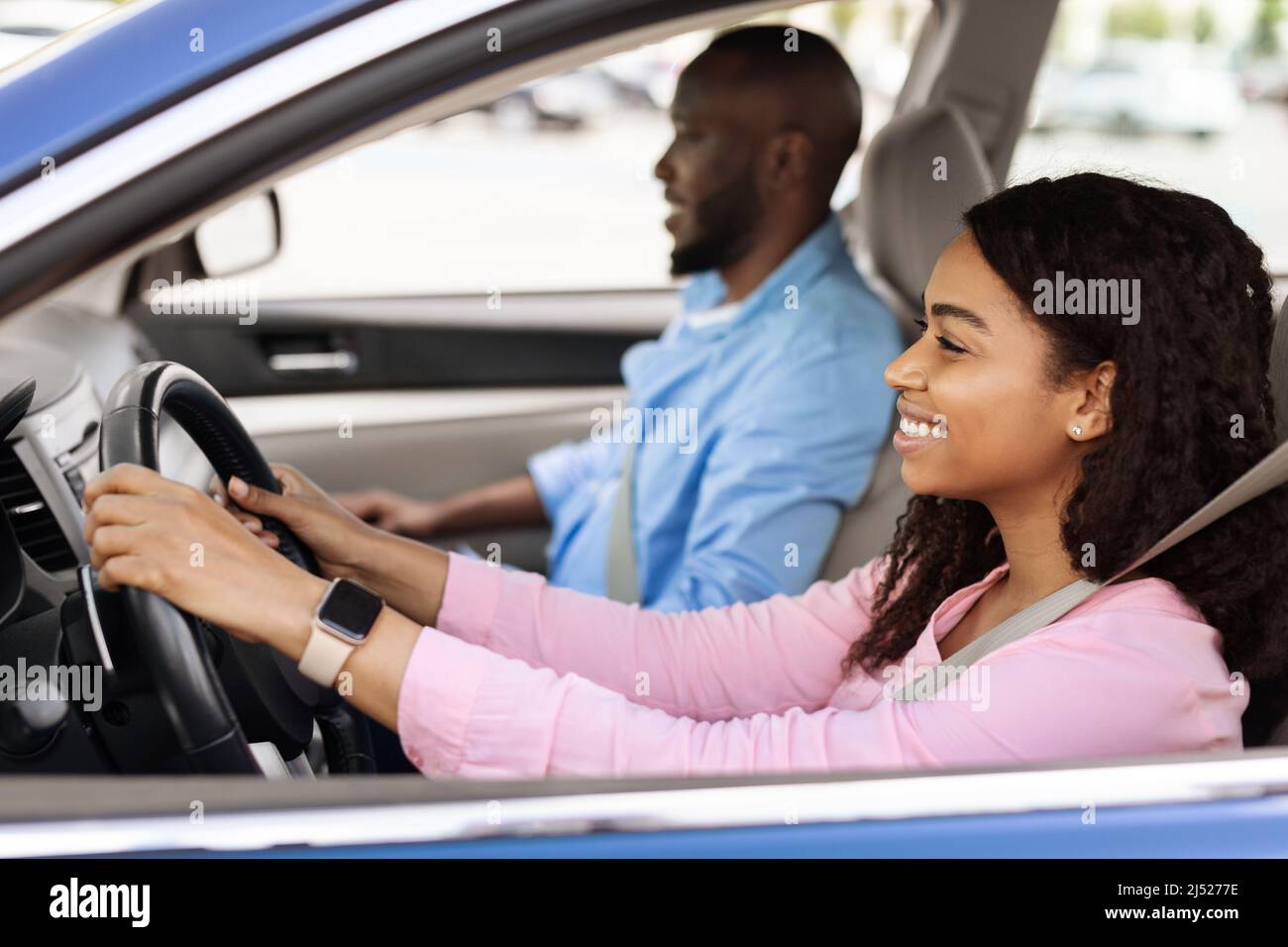 Happy black couple enjoying long drive on a car Stock Photo - Alamy