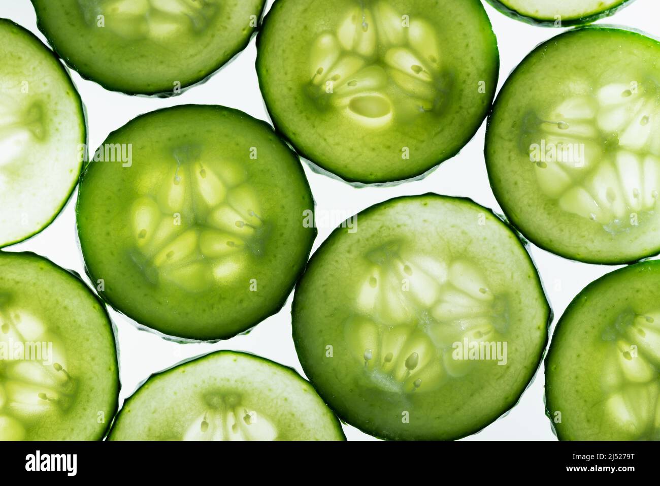 background with cucumbers. Close up of fresh Cucumber slices top view ...