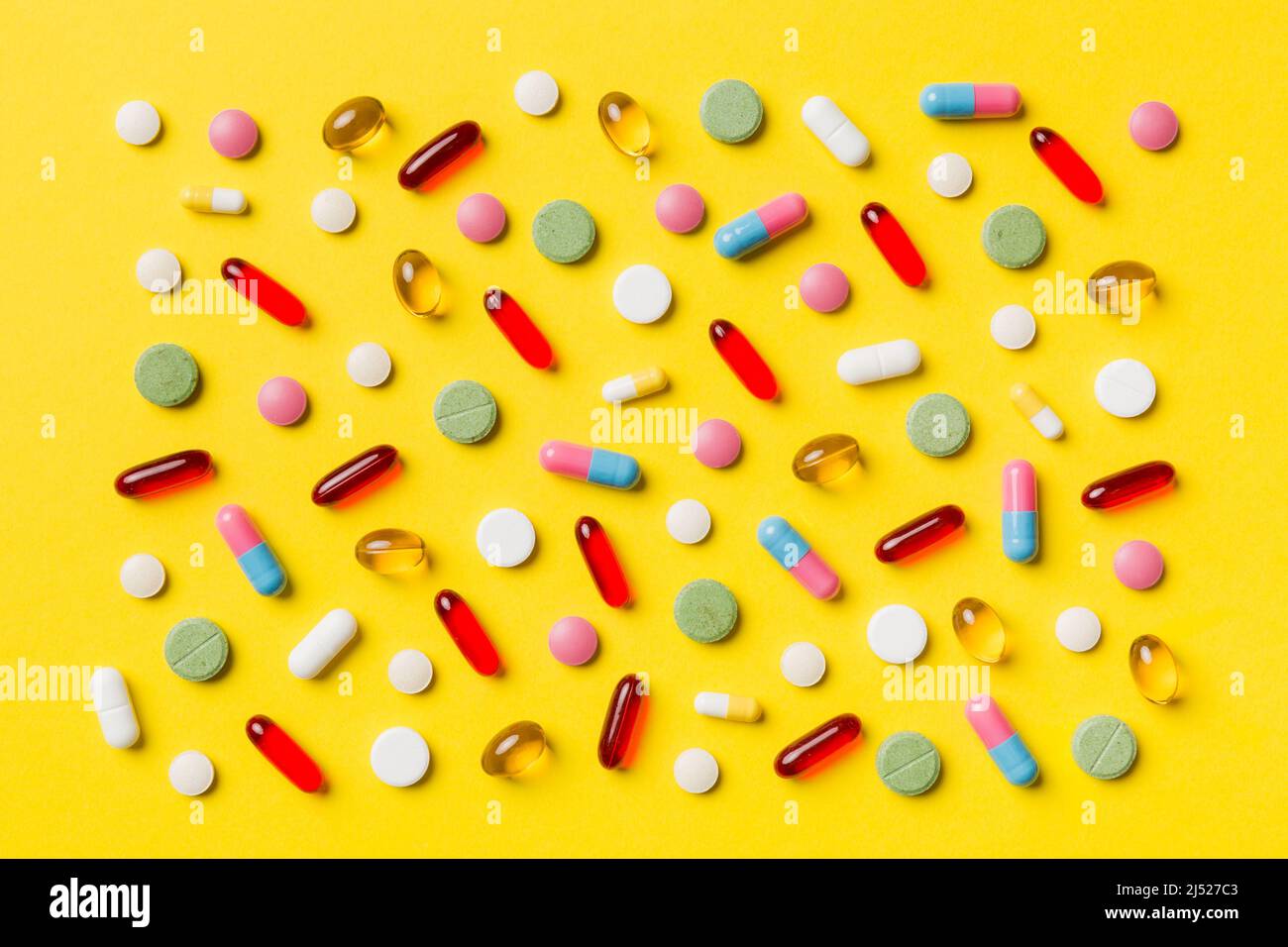 Many different pills and space for text on colorful background, top ...