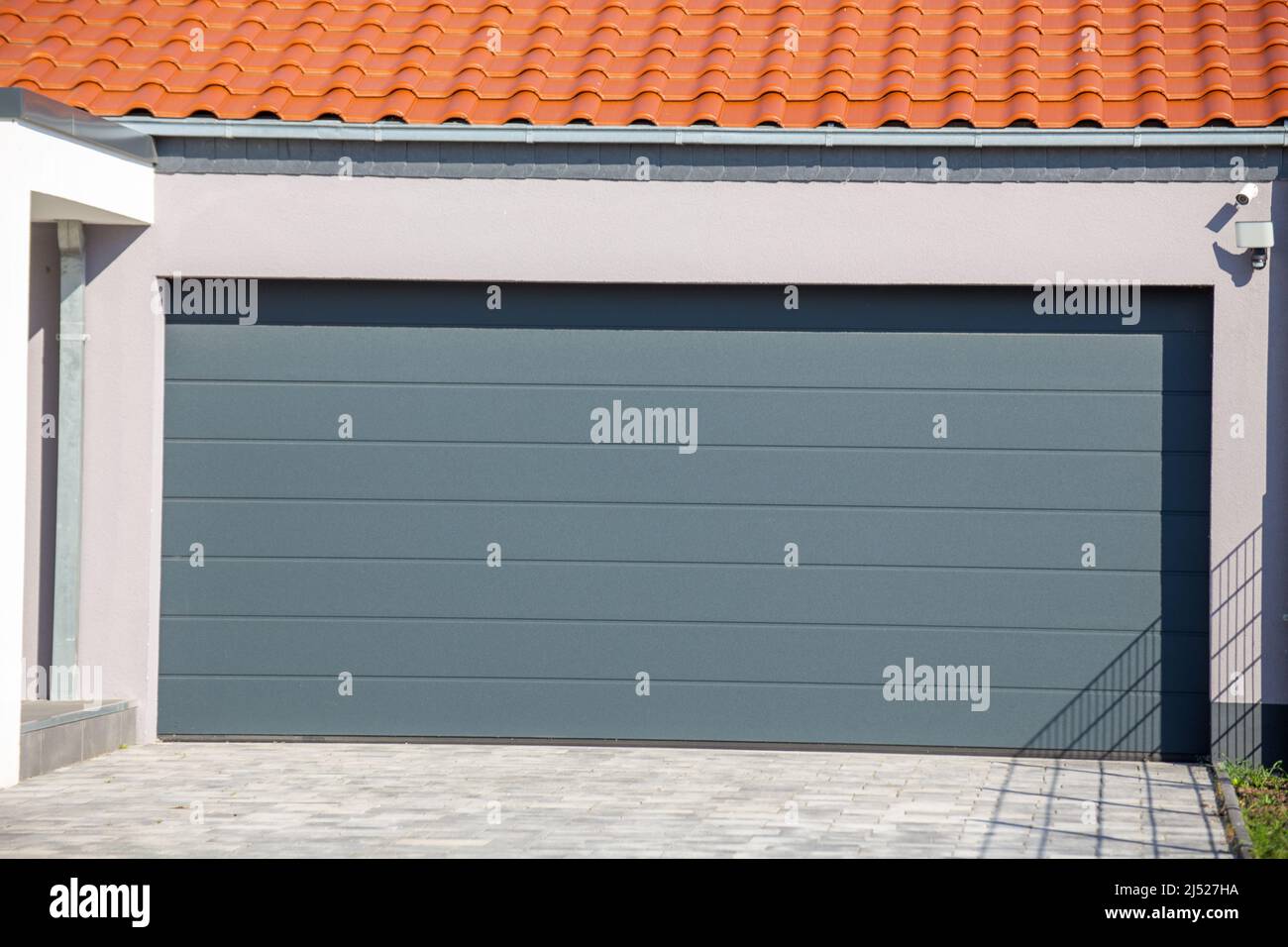 Modern grey garage door (sectional door Stock Photo - Alamy