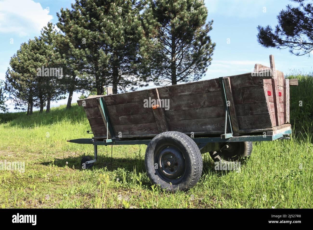 An old wooden trailer for transporting wood and coal in the countryside ...