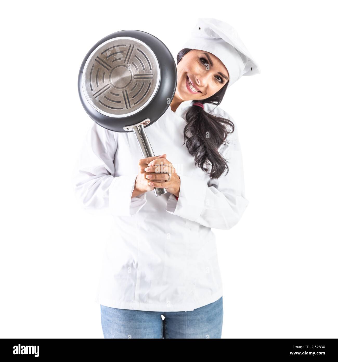 Chef brunette woman smiling from behind the pan - isolated on white ...