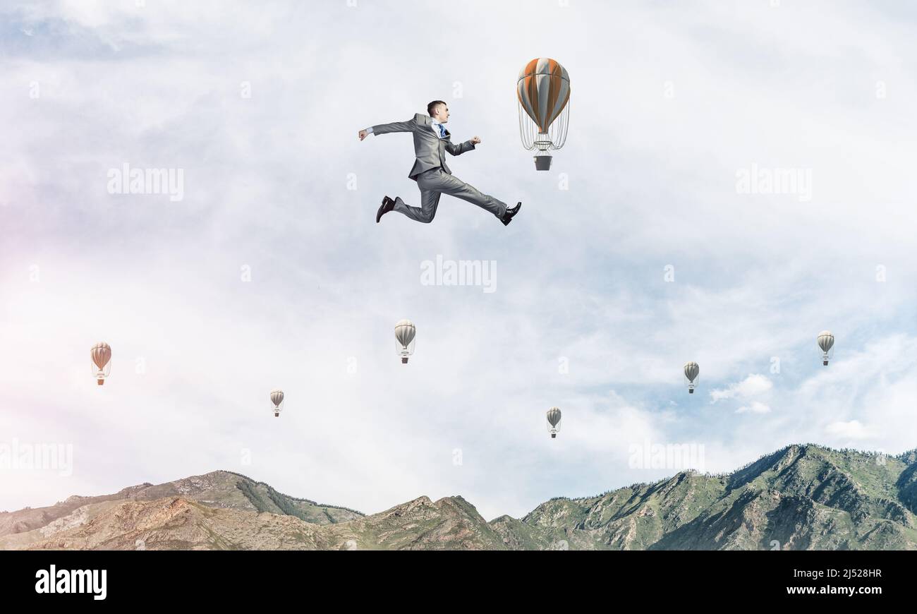 Businessman on the move Stock Photo - Alamy