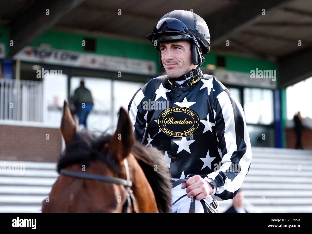 Jockey Brian Hughes with horse Imperial Merlin after winning the Free ...