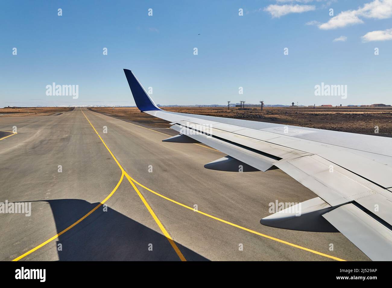 Plane wing from window before takeoff Stock Photo - Alamy